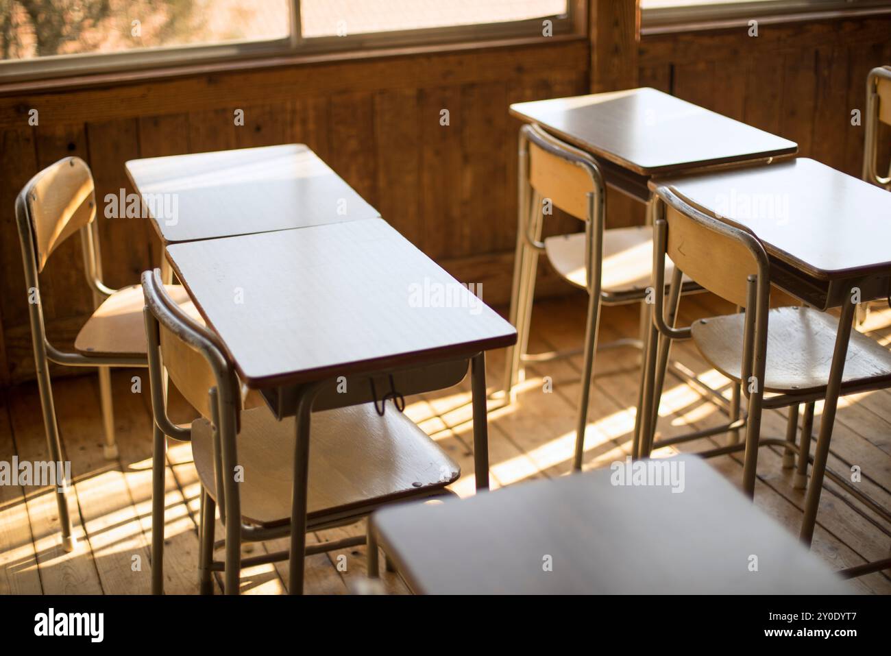 Desks and chairs in a wooden school building Stock Photo - Alamy