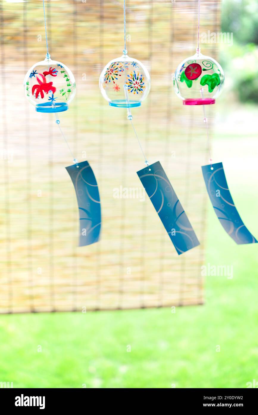 A wind chime and a reed screen Stock Photo - Alamy