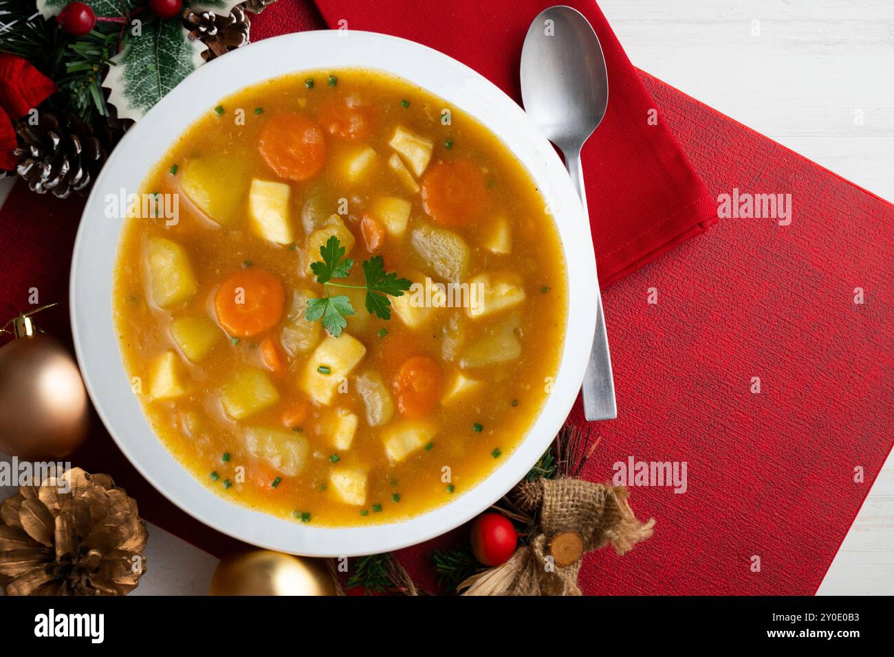 Squid stew with potatoes and vegetables. Top view table with Christmas ...