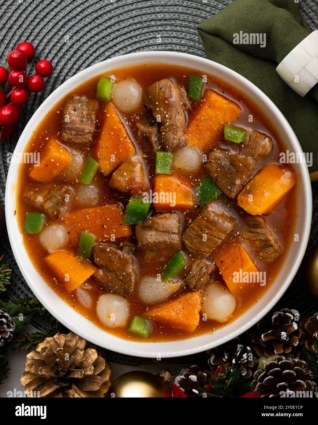 Beef stew with pumpkin and green beans. Top view table with Christmas ...