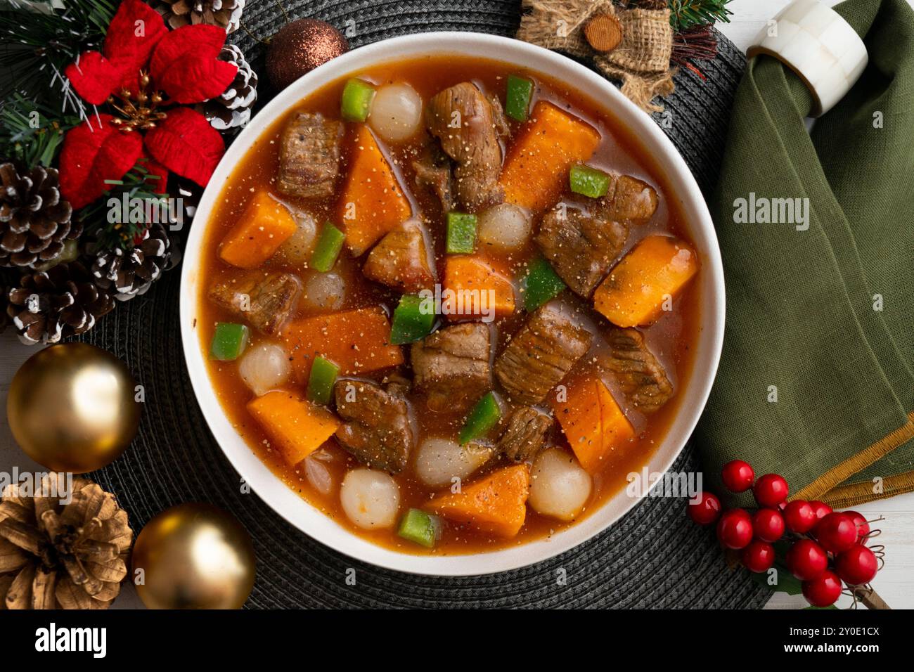 Beef stew with pumpkin and green beans. Top view table with Christmas ...