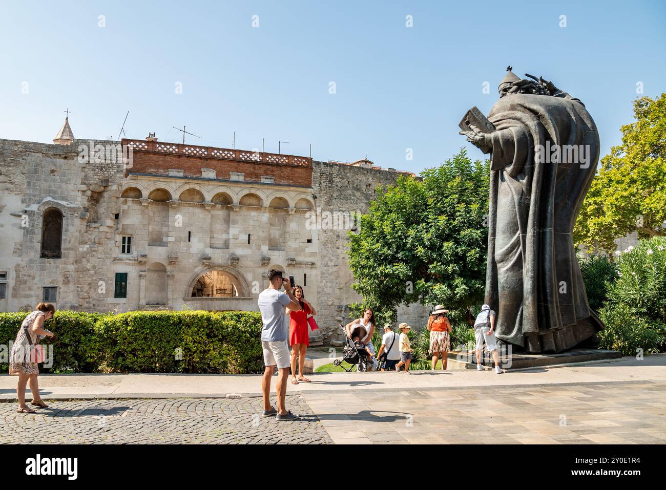 Tourists in front of the Statue of bishop Grgur Ninski (Gregory of Nin ...