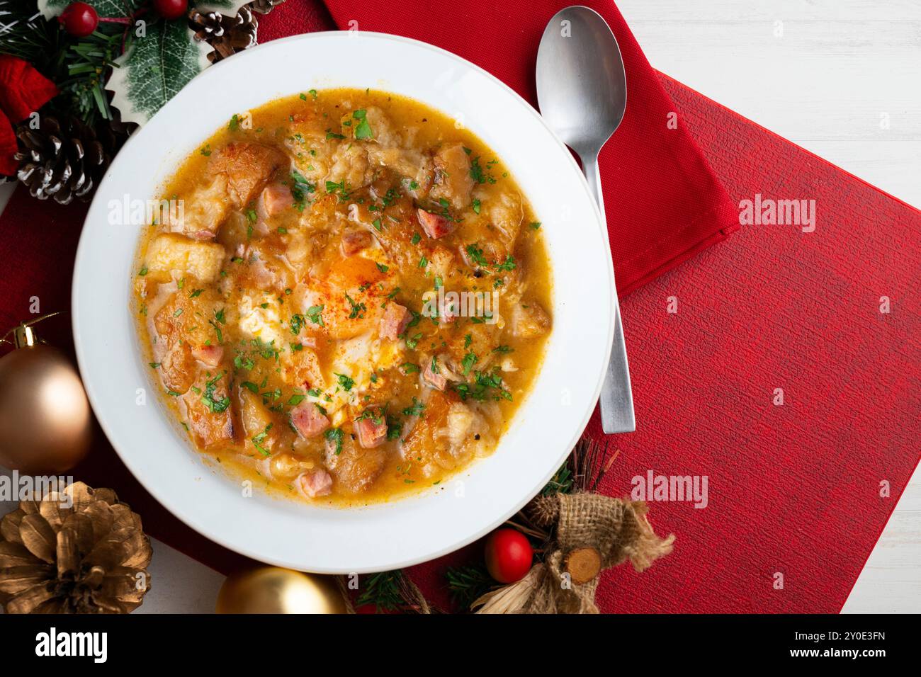 Castilian soup with vegetables, bread croutons and egg. Top view table ...