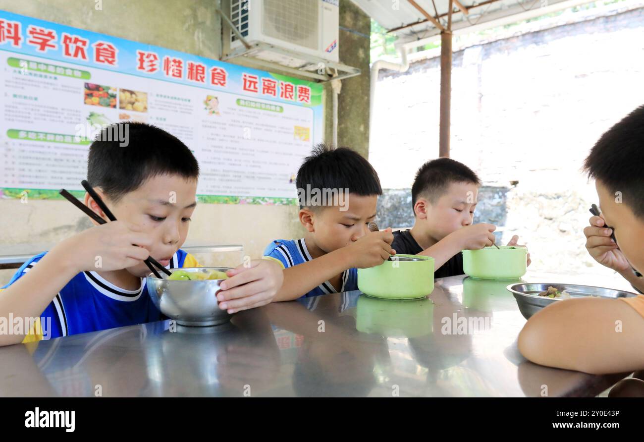 LIUZHOU, CHINA - SEPTEMBER 2, 2024 - Students eat a nutritious lunch at ...