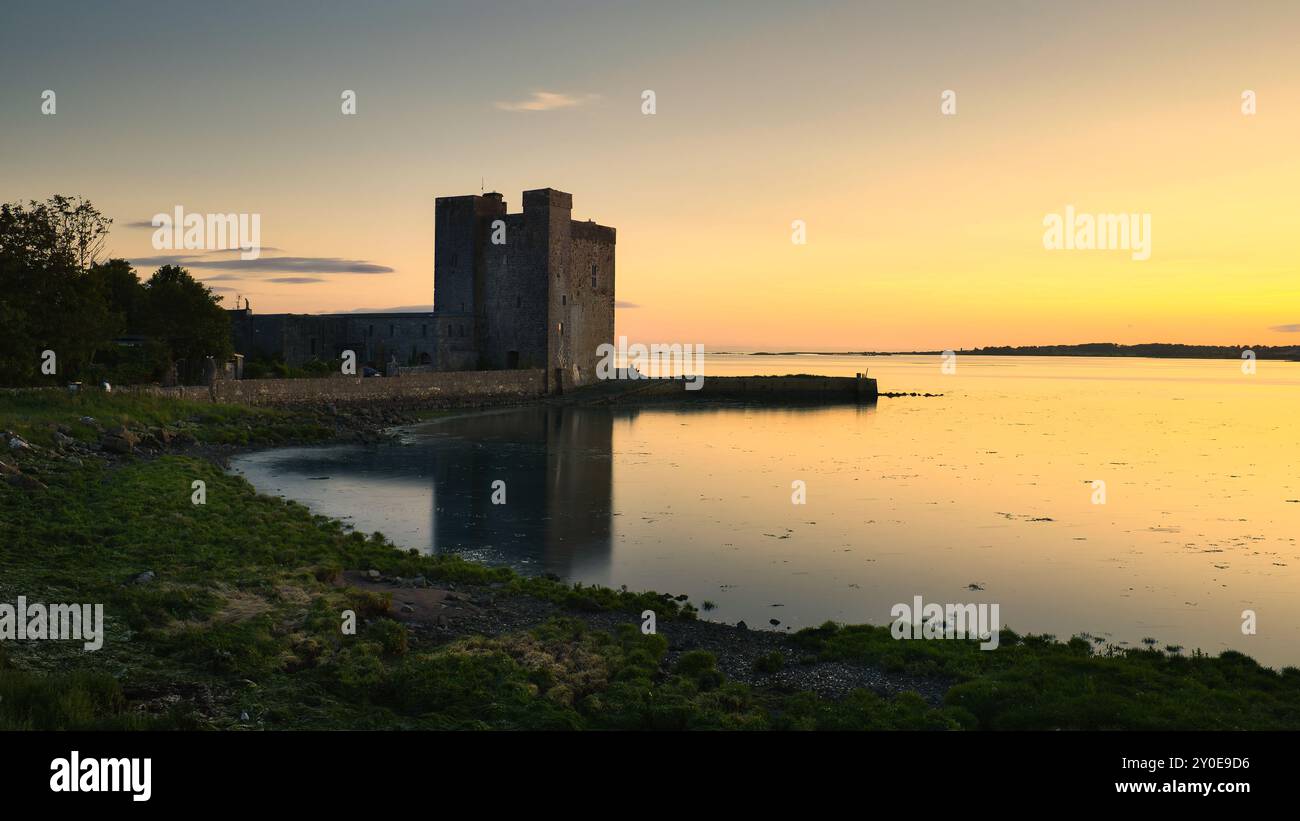 Beautiful coastal sunset scenery with historical landmark Oranmore ...