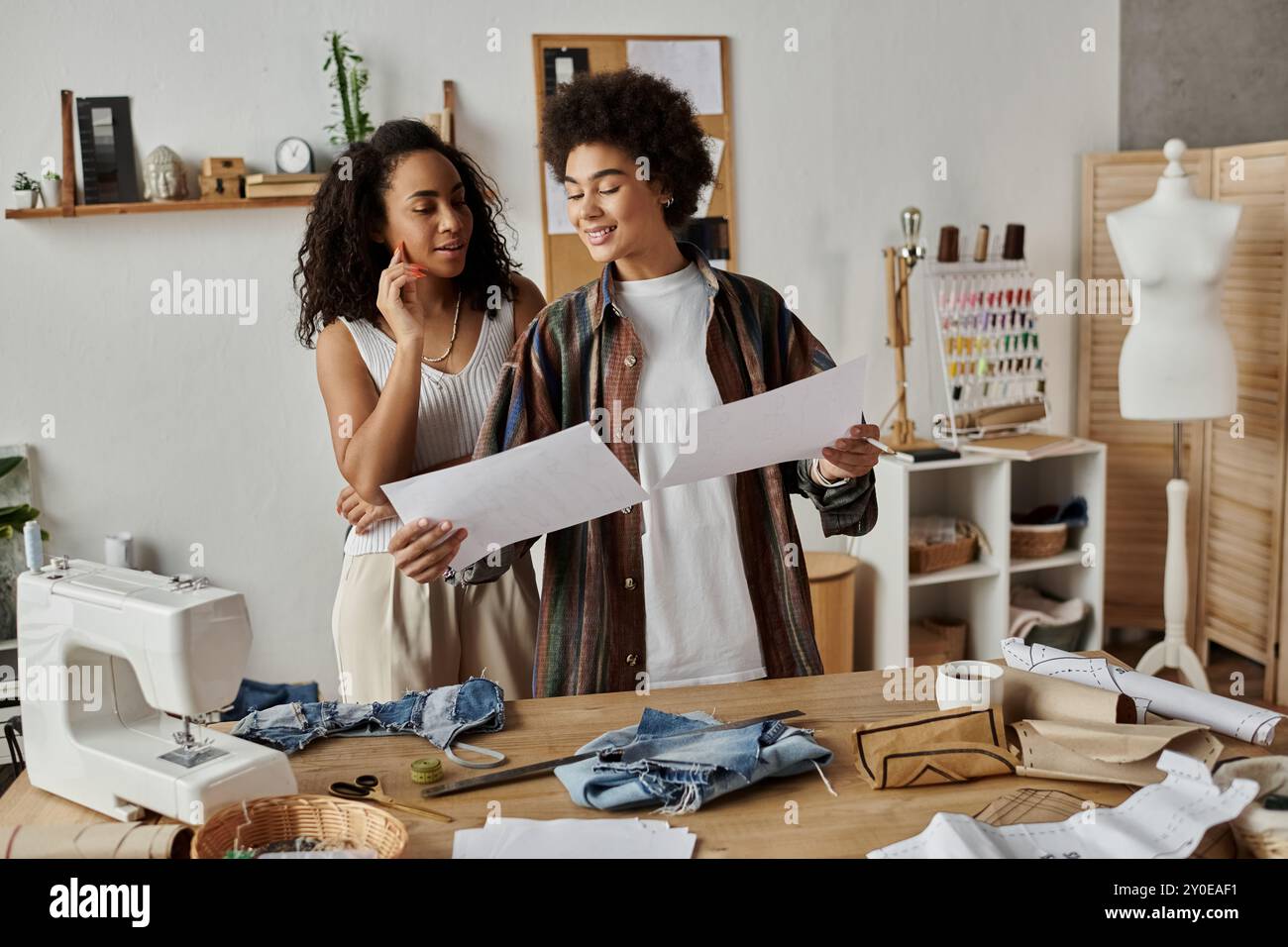 Couple joyfully transforms their clothing in a cozy workspace Stock ...