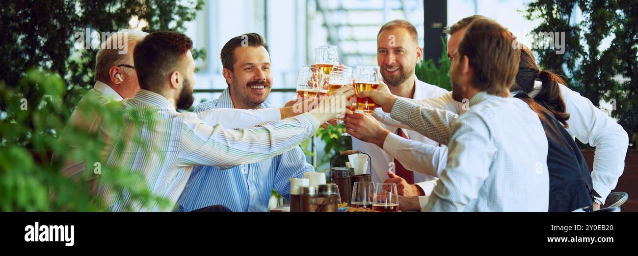 Cheers to successful project. Group of colleagues, business people, men ...