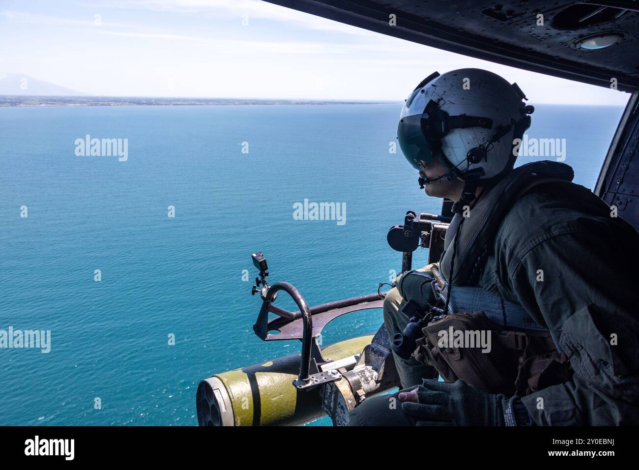 U.S. Marine Corps Cpl. Scott Detar, a UH-1Y Venom helicopter crew chief ...