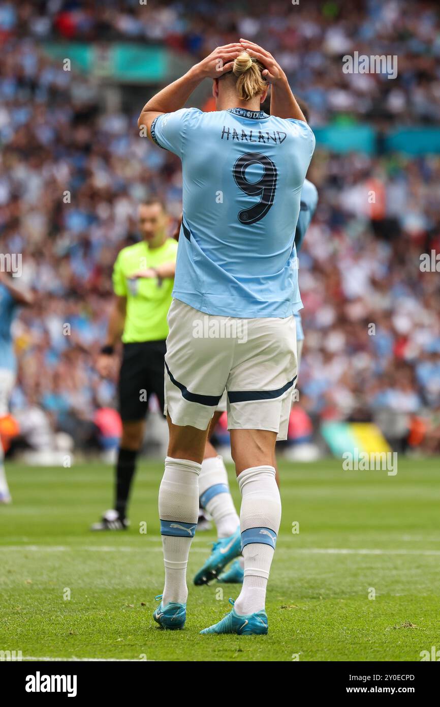 Erling Håland of Manchester City holding his head after going close ...