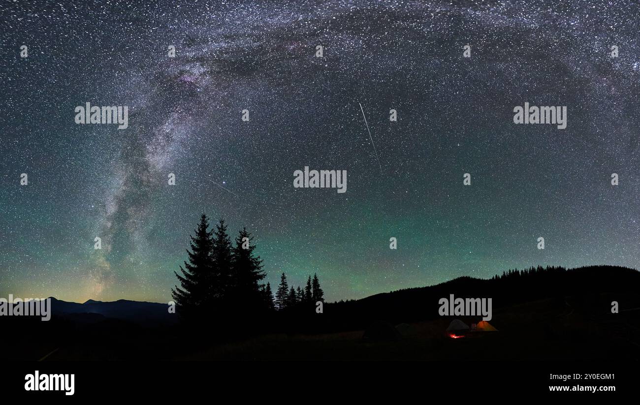 Stunning night sky, filled with stars and Milky Way, forms majestic arc ...