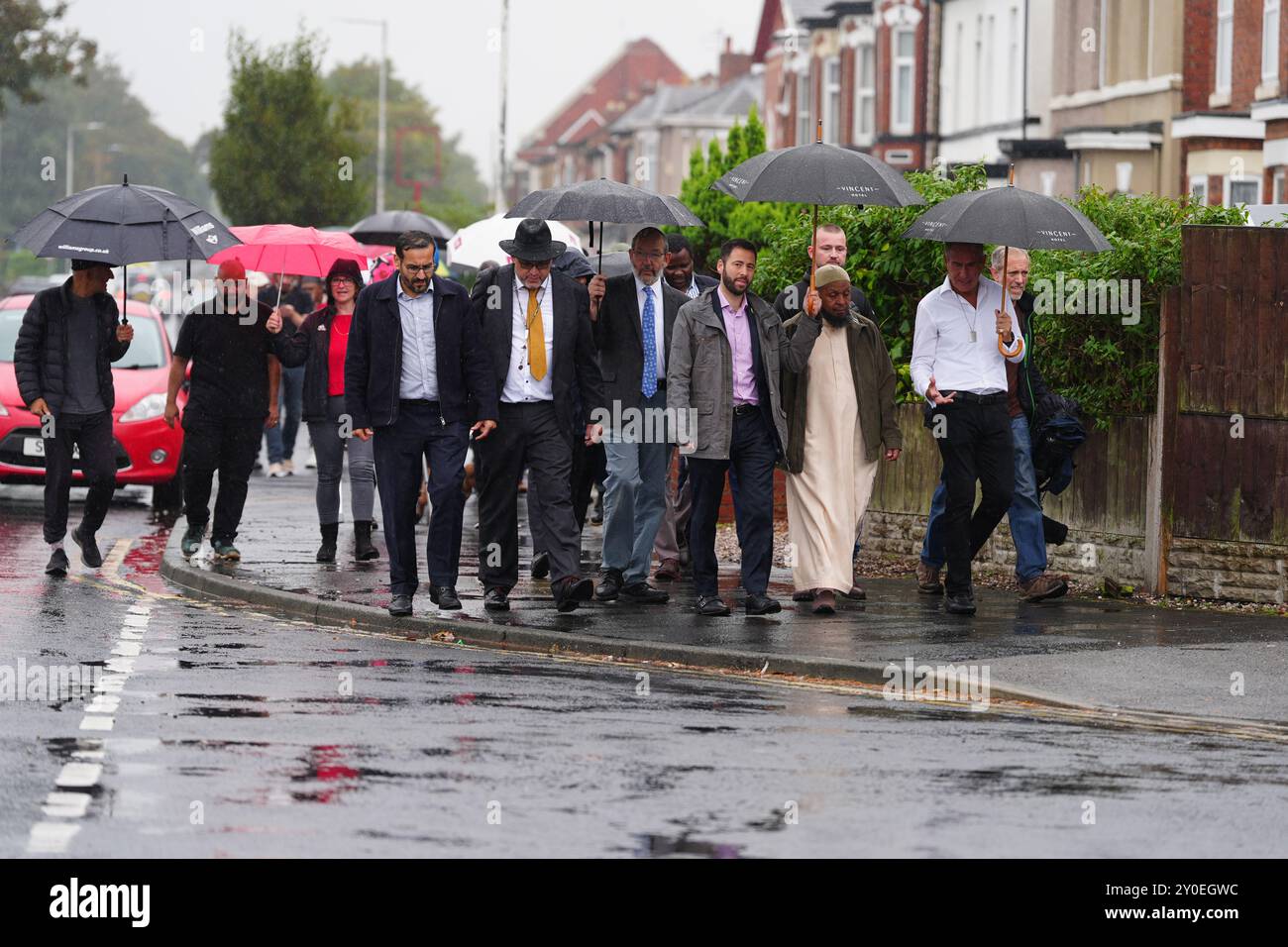 People of multiple faiths join together in a Walk of Faith from the ...