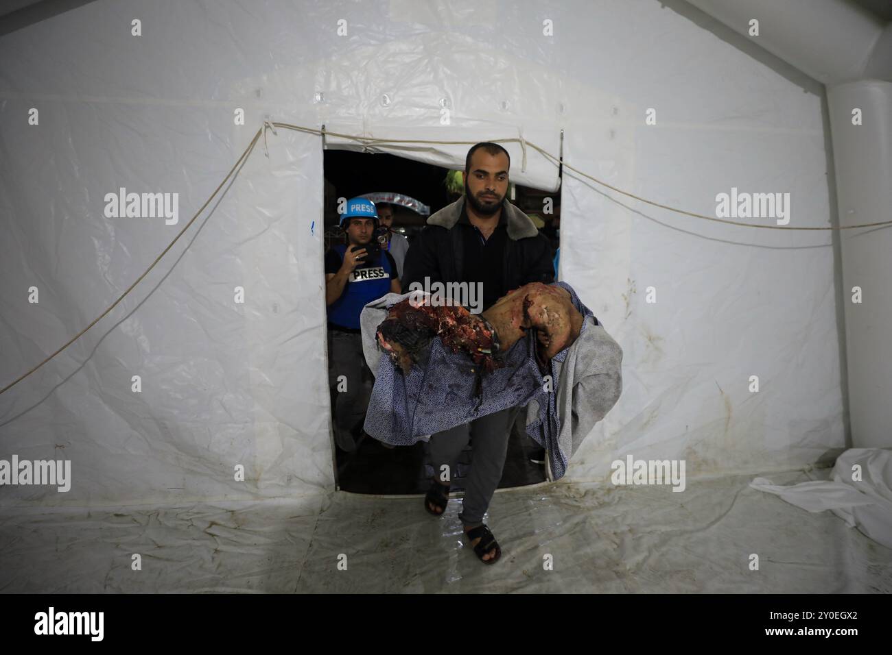 Gaza, Palestine. 12 October 2023. The body of a Palestinian crushed and mangled beyond ...