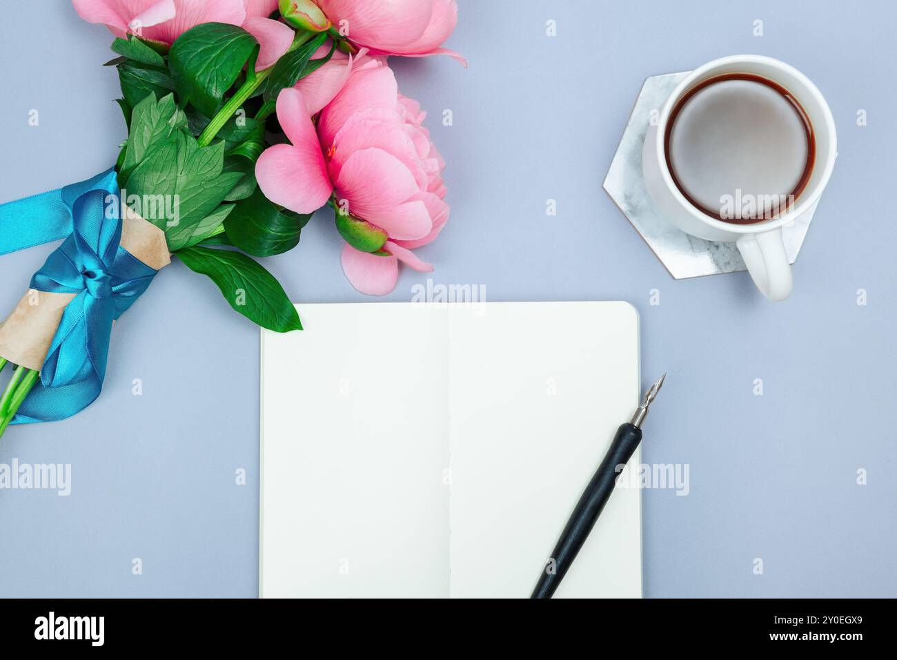 Morning work desk with open blank page notebook, writing pen, coffee ...