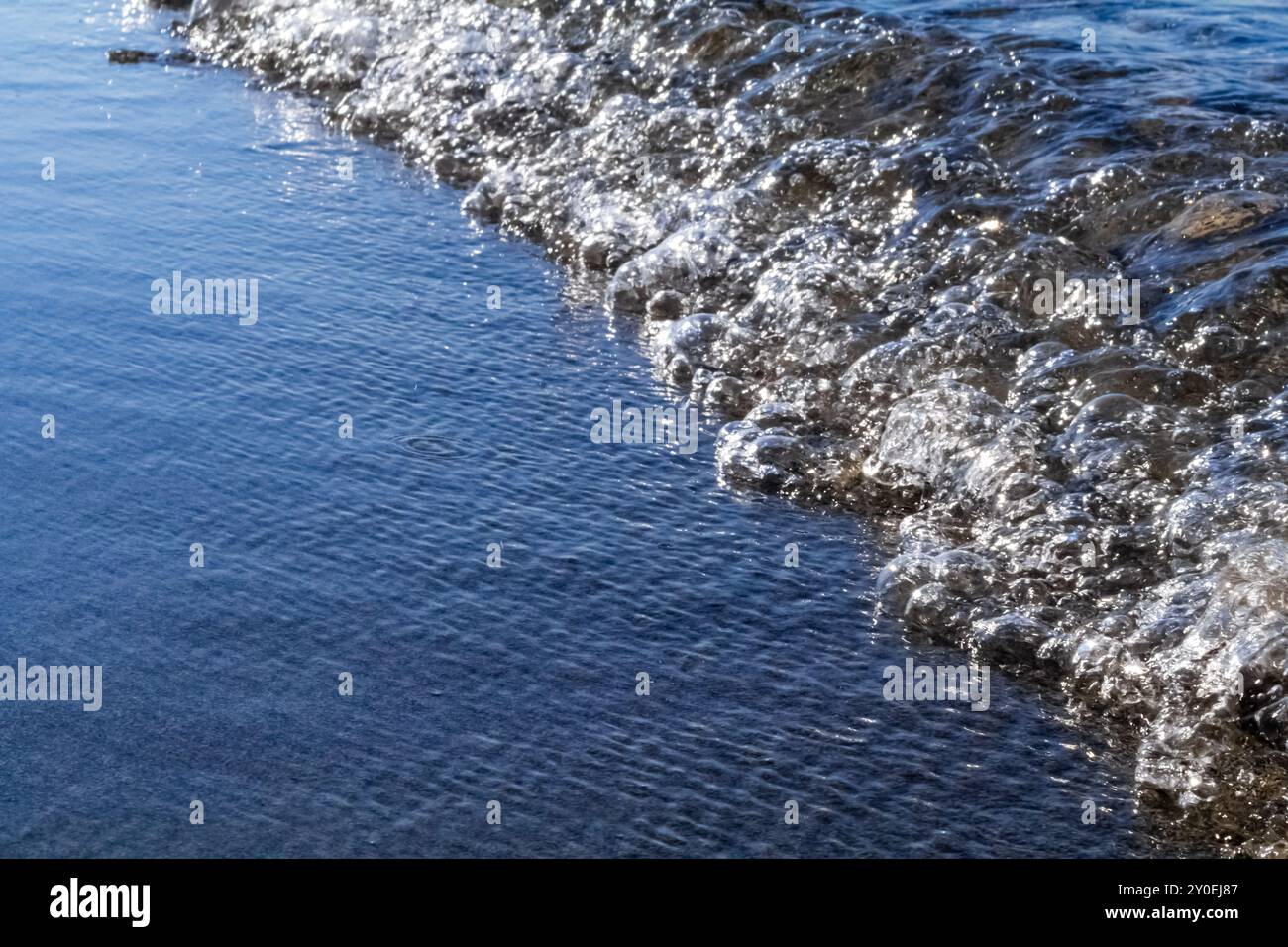 clear water waves hitting the shore Stock Photo - Alamy