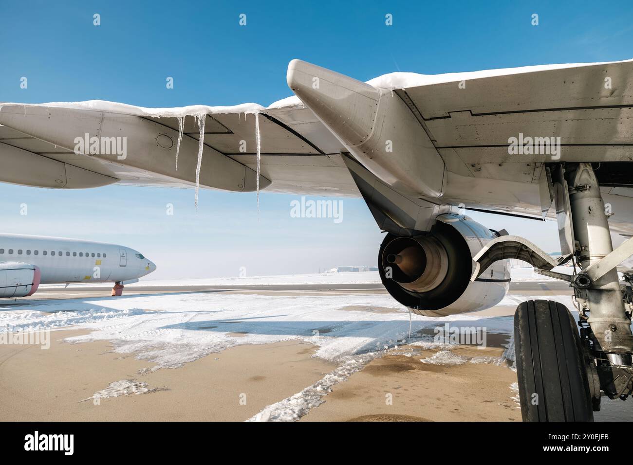Icicles on aircraft wing on frosty winter day. Airplane at snowy airport Stock Photo - Alamy