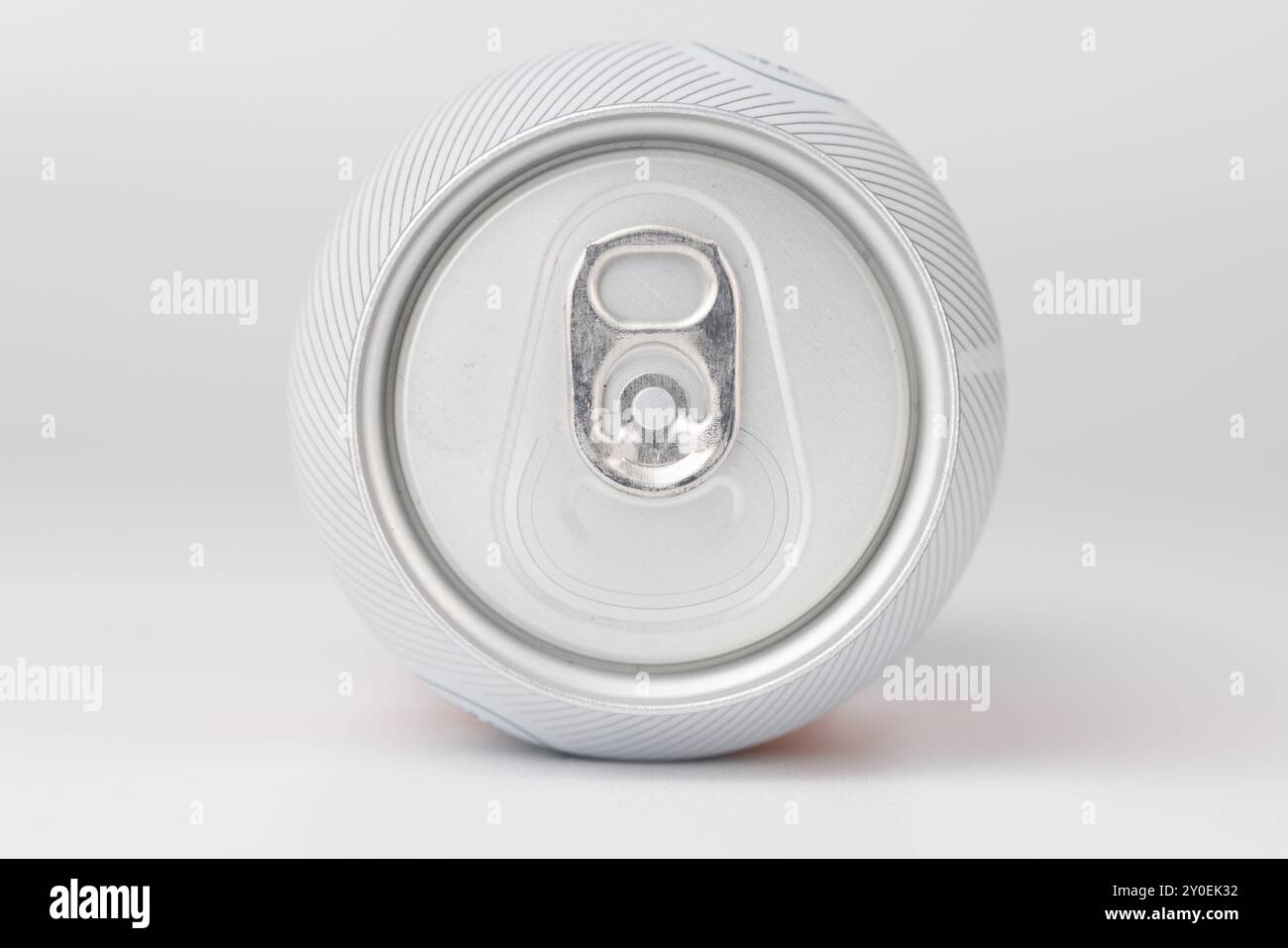 Beer can tilted and centered with detailed focus on the can’s opening ...