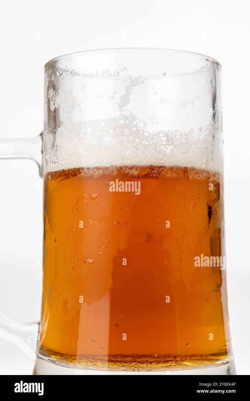 Close-up of a toasted beer glass body, captured vertically. The glass ...