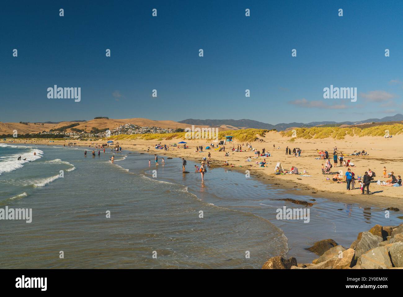 Morro Bay, California, USA. July 28, 2024. People sunbathing on Morro ...