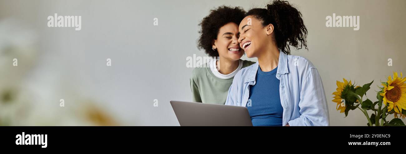 Two women share laughter and affection while enjoying a cozy day ...