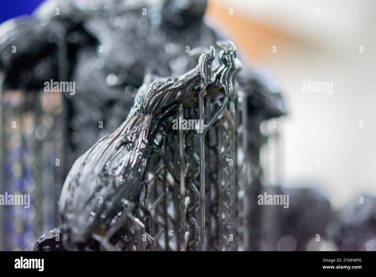 Model of hand printed on a 3D printer from black rubber, close-up. Part ...