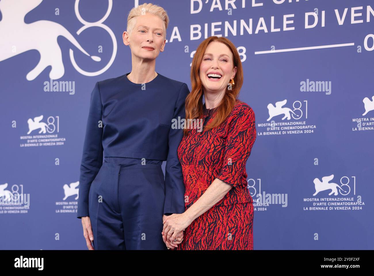 Tilda Swinton, left, and Julianne Moore pose for photographers at the ...