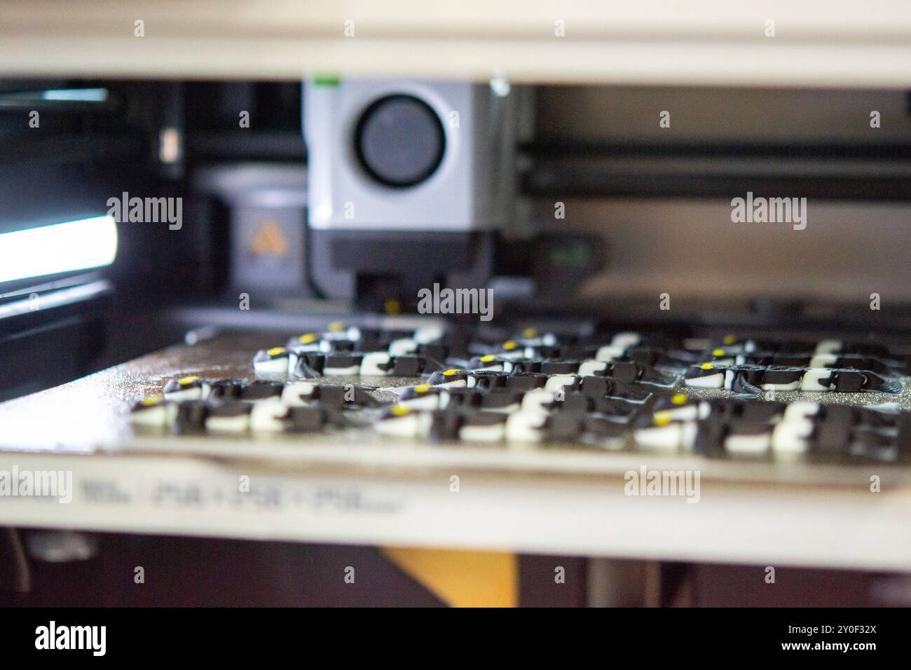 3D printer close up. A working 3D printer in process of printing object ...