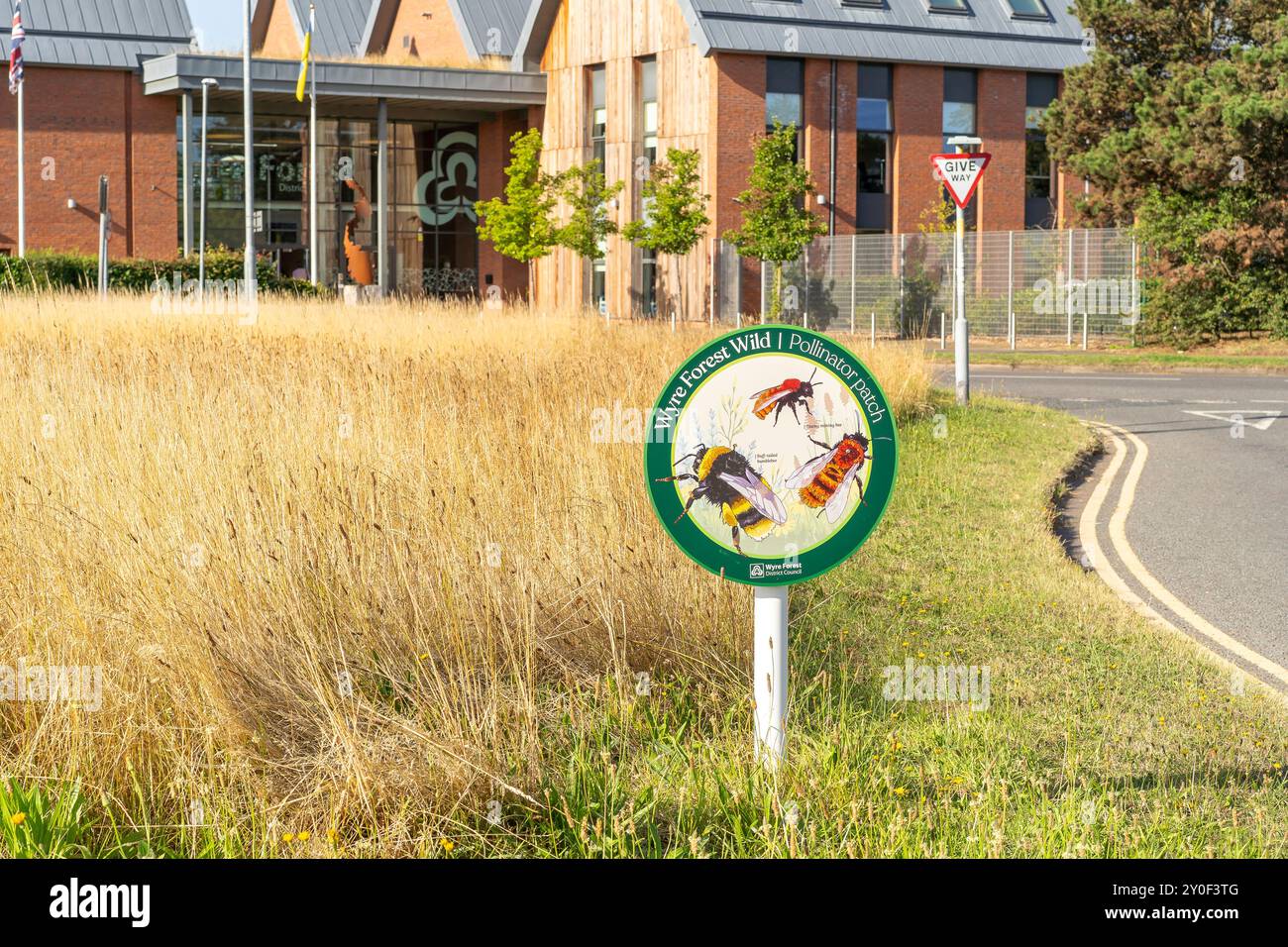 Large circular sign showing a bee pollinator patch outside council ...