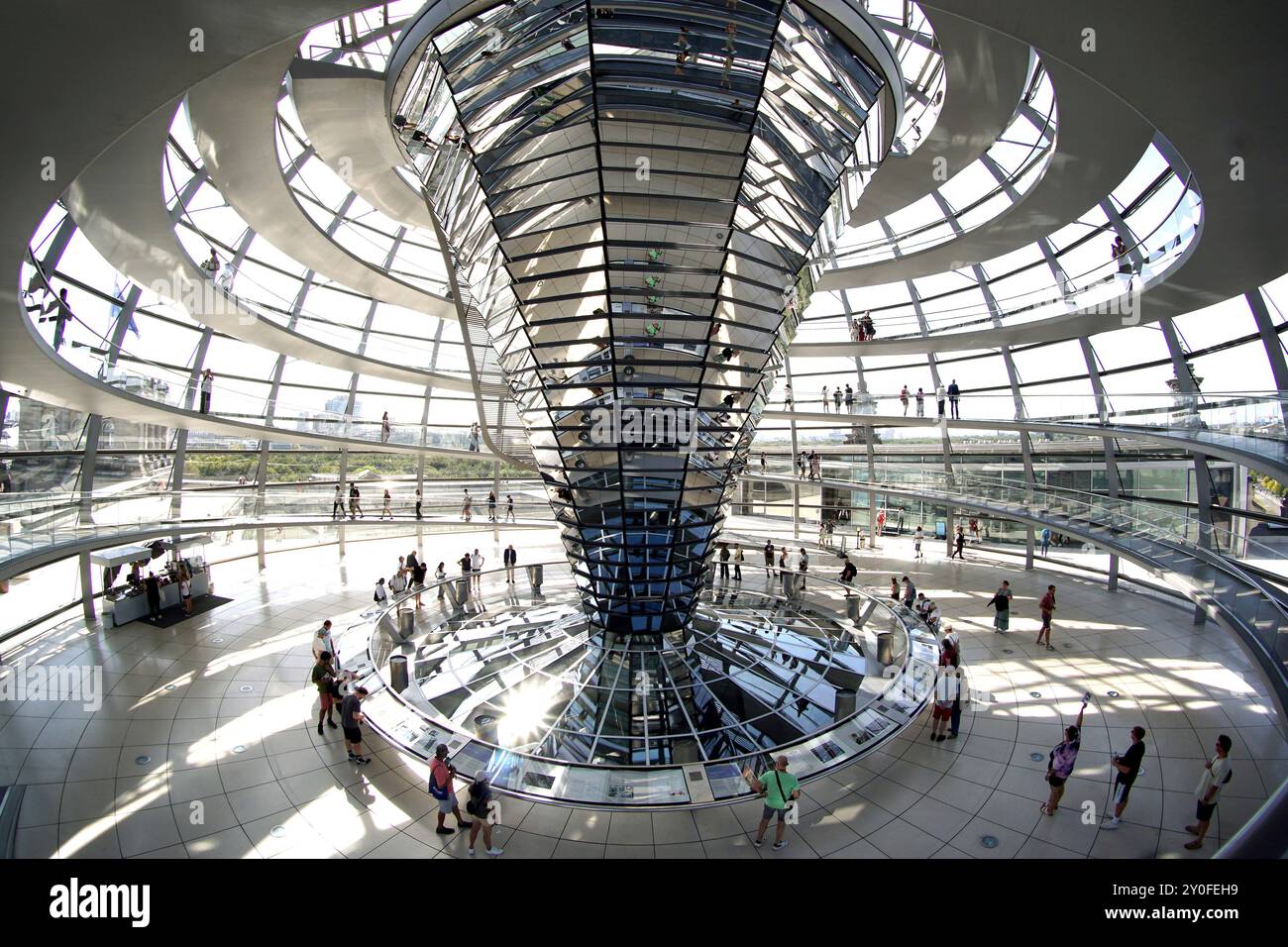 The sun shines as people visit the dome of the Reichstag building, home ...