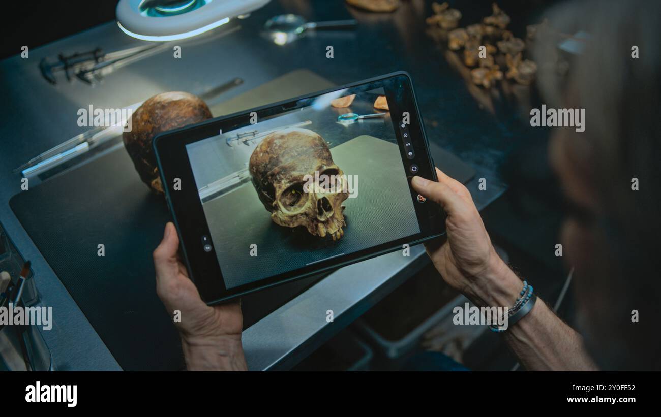 Archaeologist takes photo of fossil remains of prehistoric extinct ...