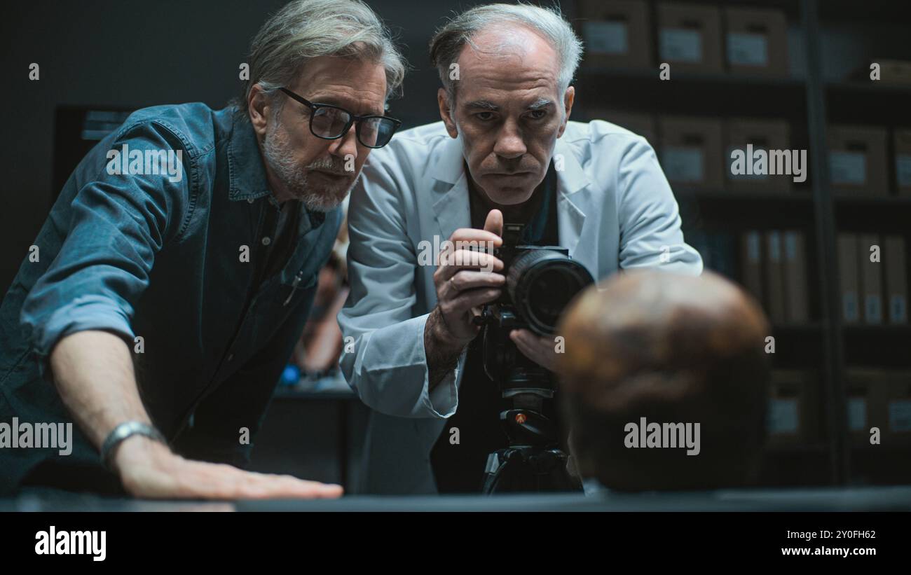 Modern archaeological lab: Two archaeologists or scientists photograph ...
