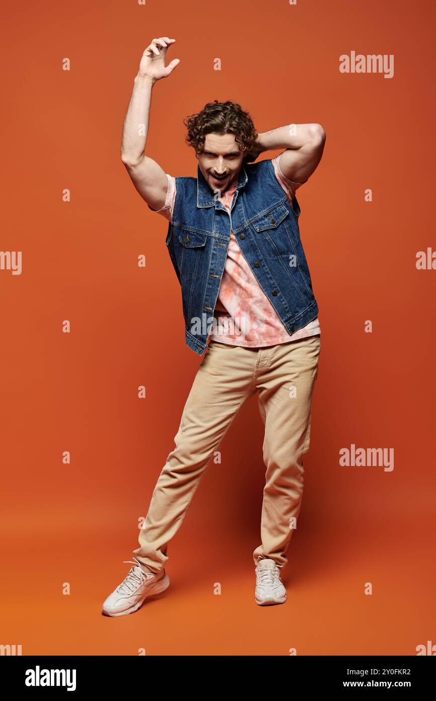 A vibrant backdrop enhances a man's dynamic emotional pose Stock Photo ...