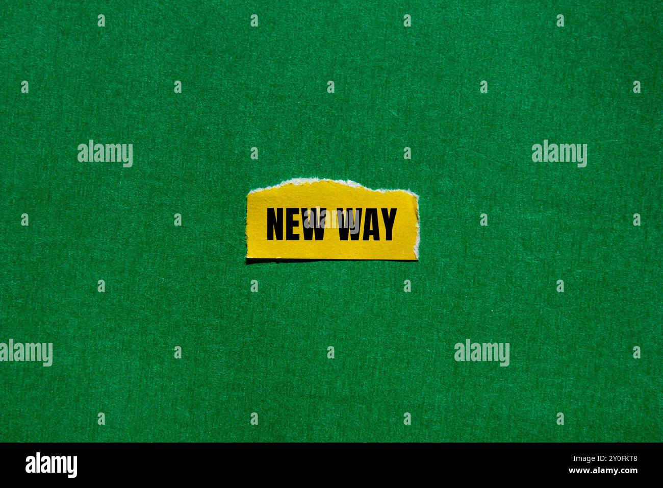 New way message written on ripped torn yellow paper piece with green ...