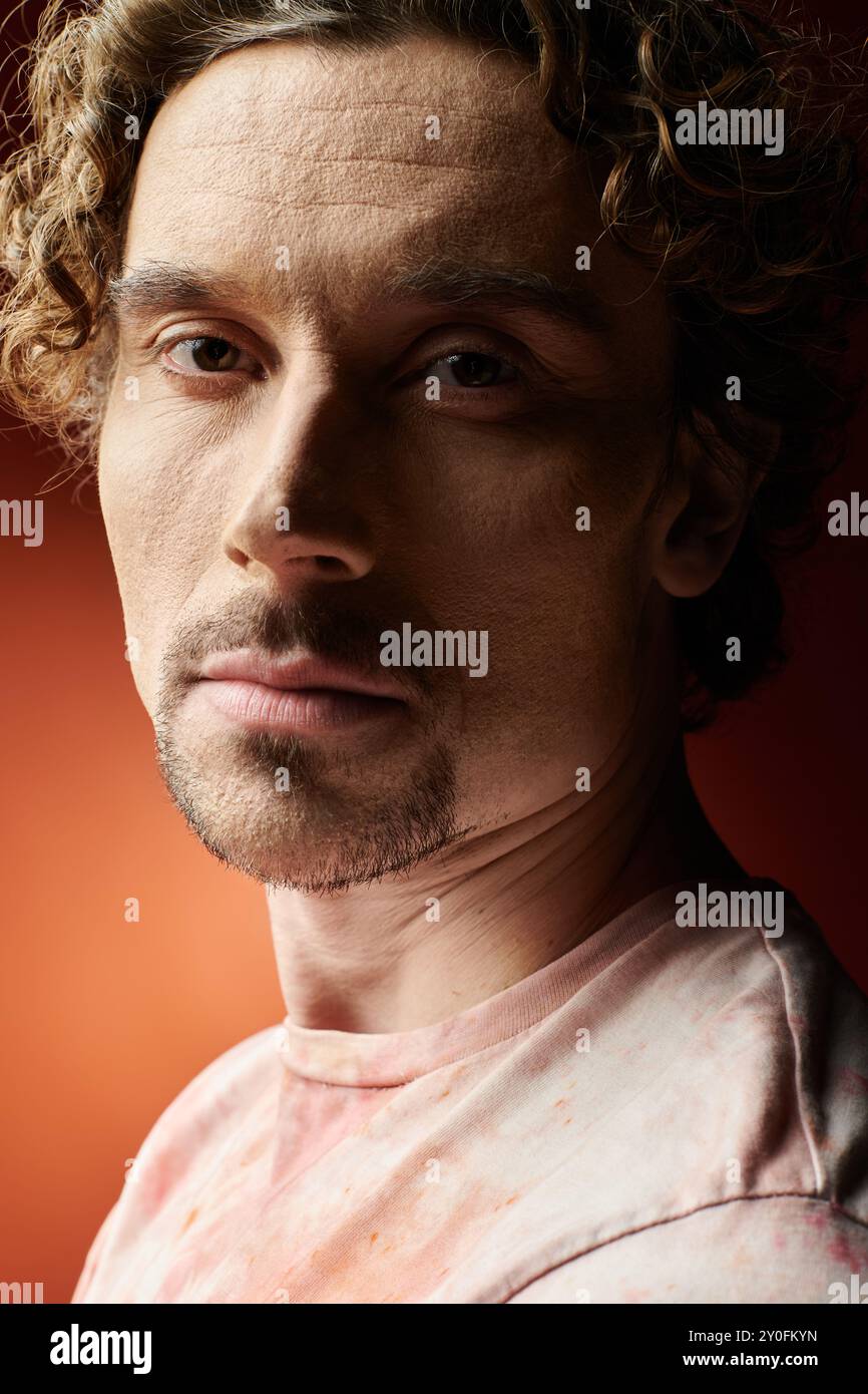 A handsome man shares his emotional depth in vibrant hues Stock Photo ...