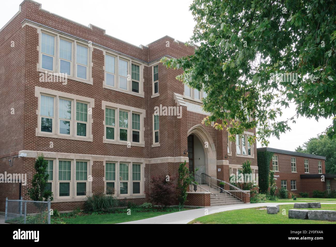 Three-story generic school building with a brick facade and older ...