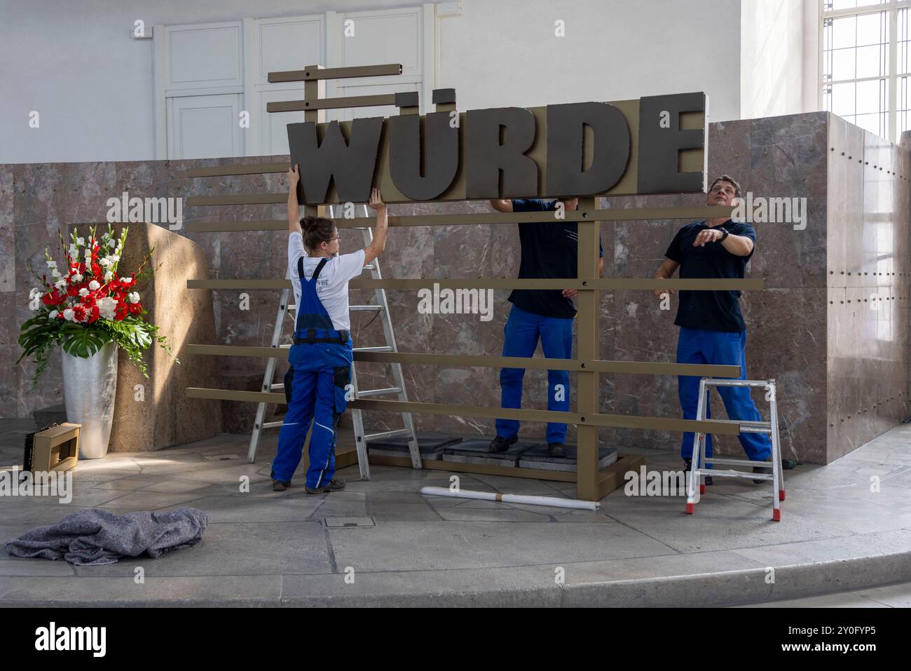 02 September 2024, Hesse, Frankfurt/M.: Experts mount the word "Dignity ...