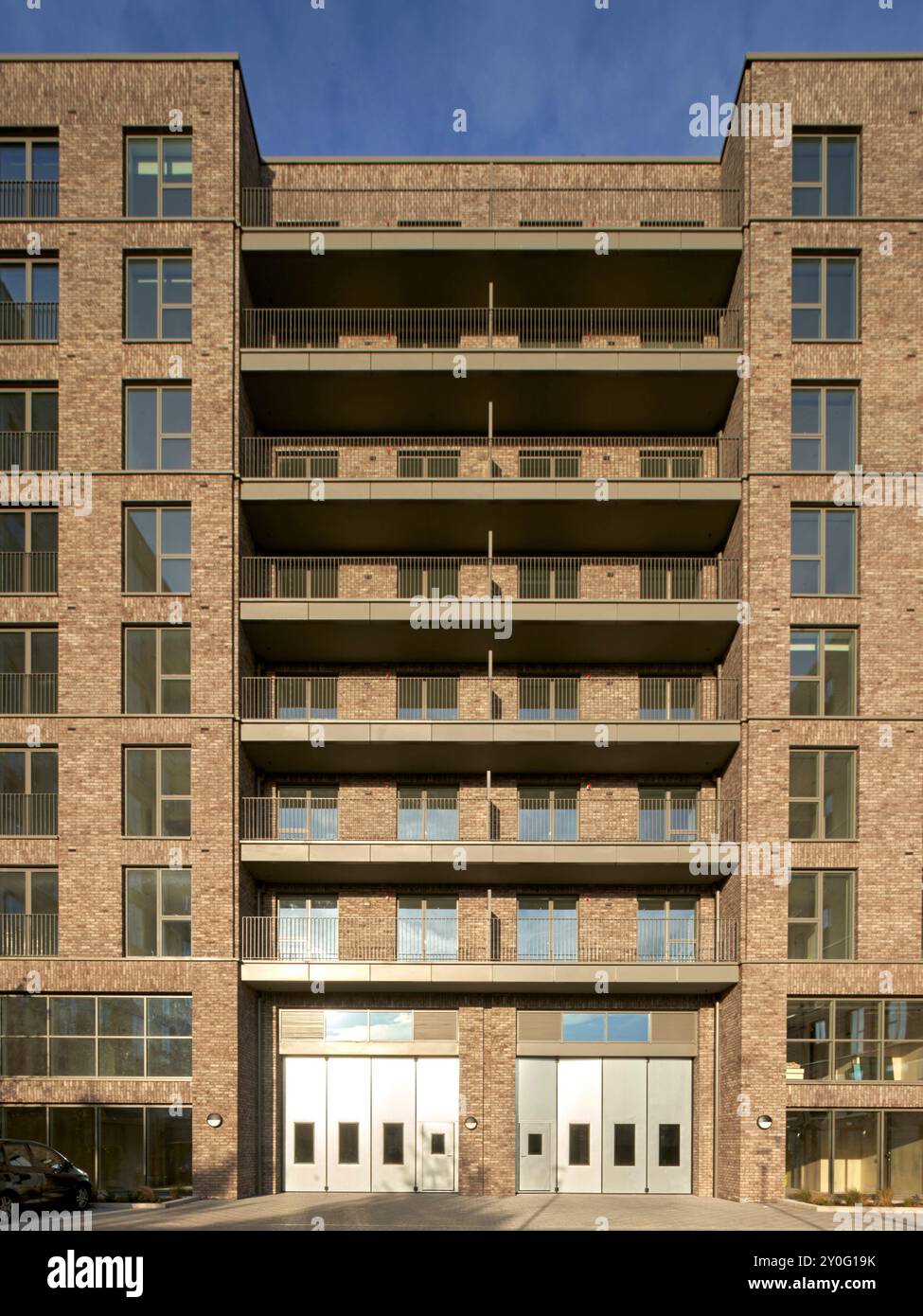 Front elevation of multi-storey brick building. Osier Way, London ...