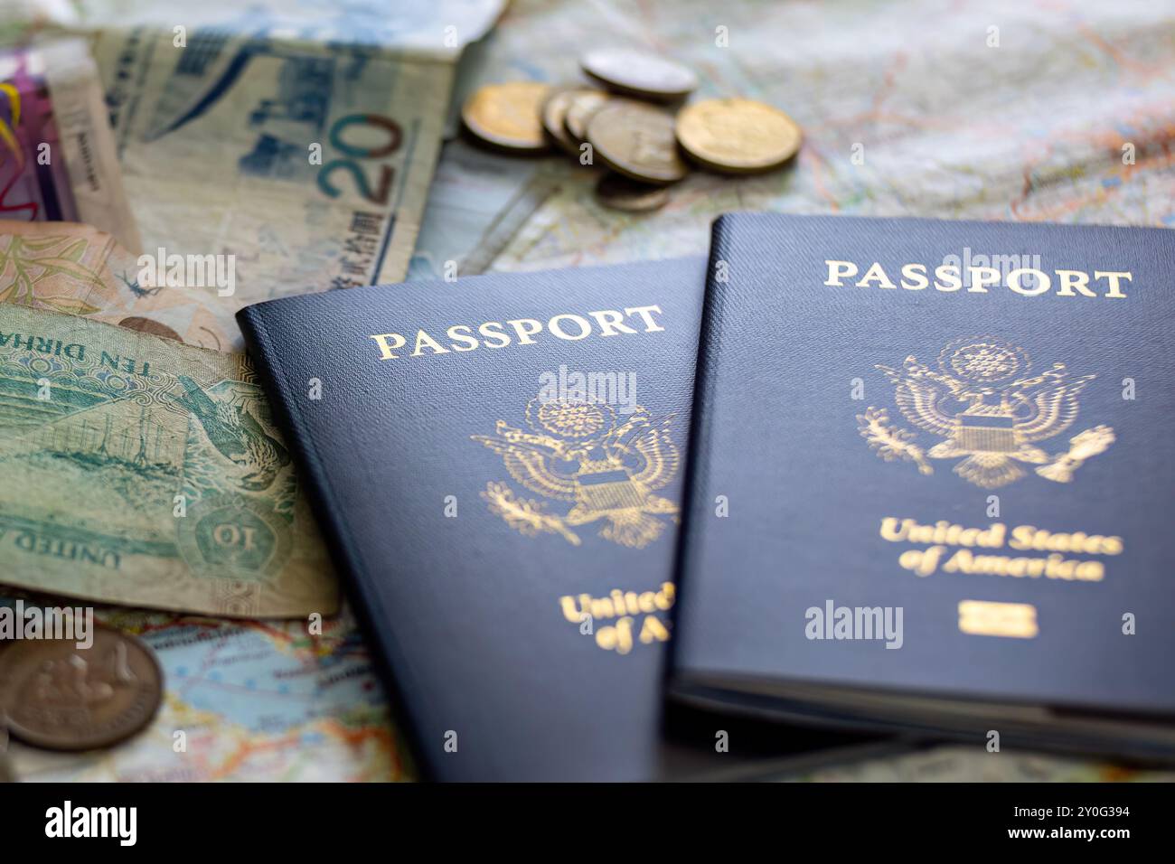 American Passports on Street Map with Foreign Currency Stock Photo - Alamy