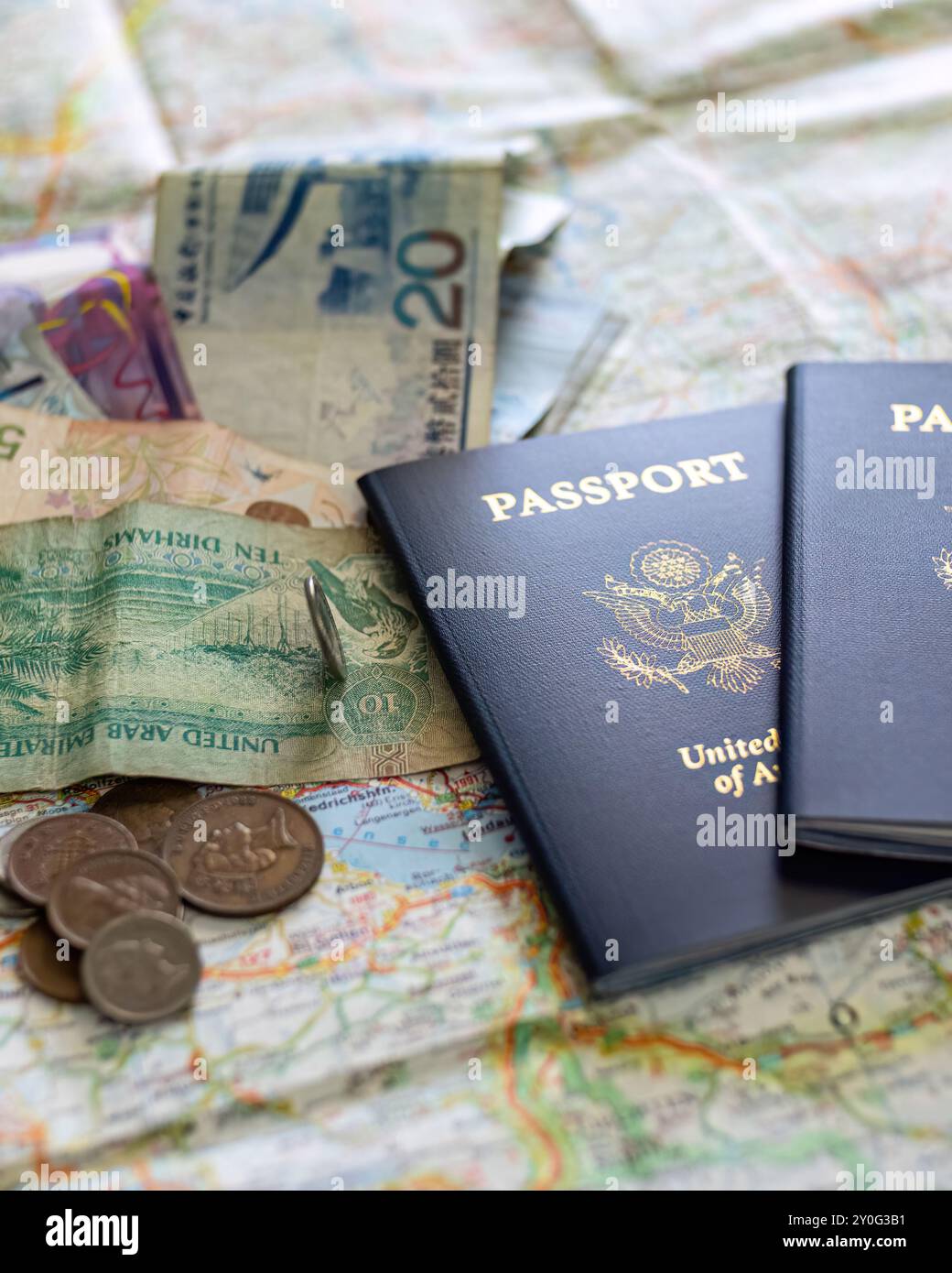 American Passports on Street Map with Foreign Currency Stock Photo - Alamy