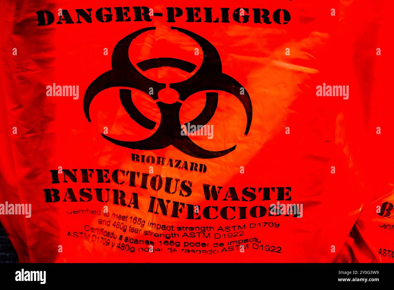 Closeup of an Orange Bag with Biohazard Symbol and "Danger, Infectious ...