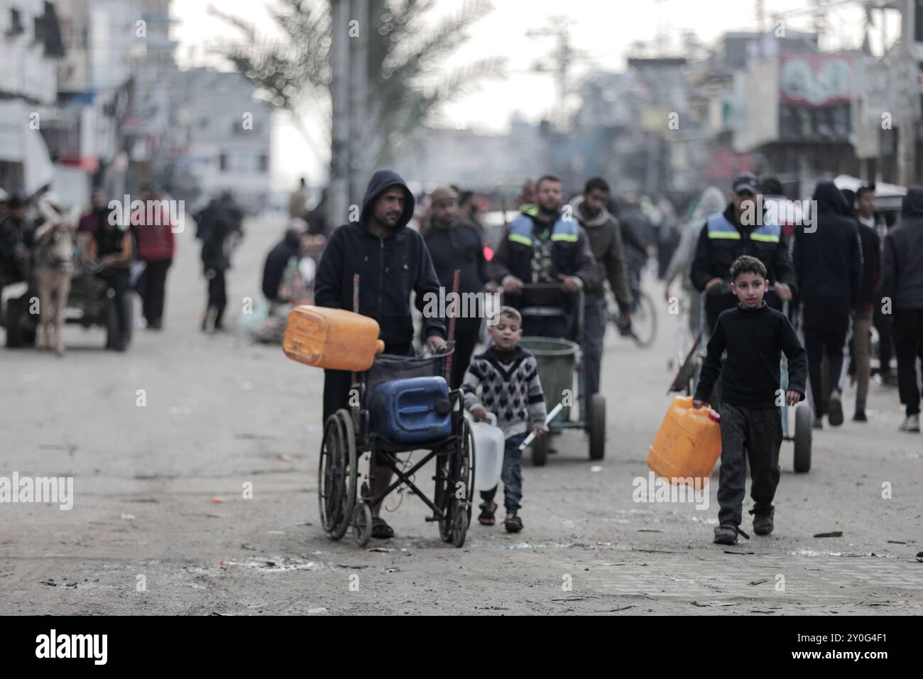 Deir Al Balah, Gaza Strip, Palestine. Palestinians walk with empty ...