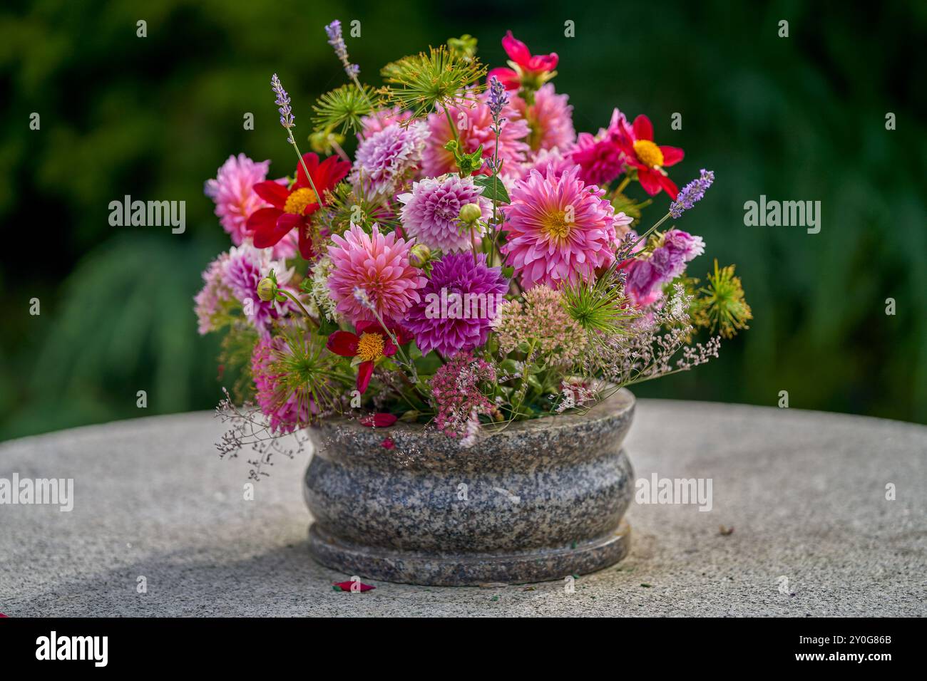 Bunch of colourful flowers in a stone pot hi-res stock photography and ...