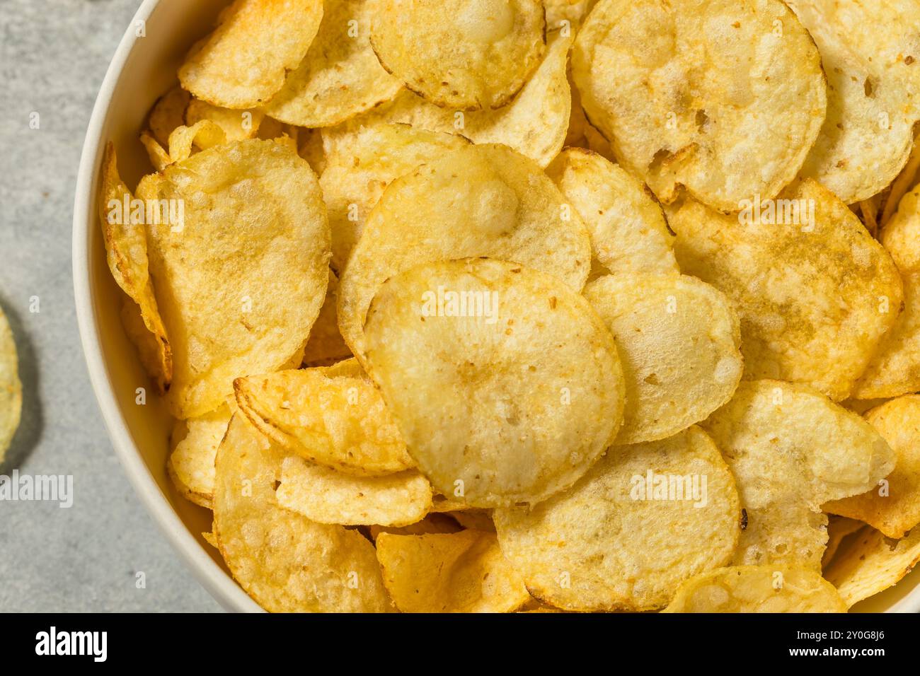 Salty Homemade Kettle Cooked Potato Chips with Salt Stock Photo - Alamy
