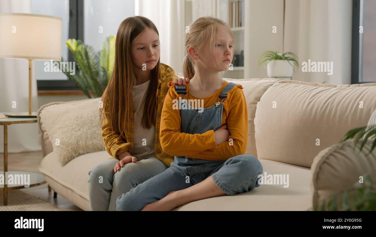 Upset angry little Caucasian children girls sisters kids friends ...