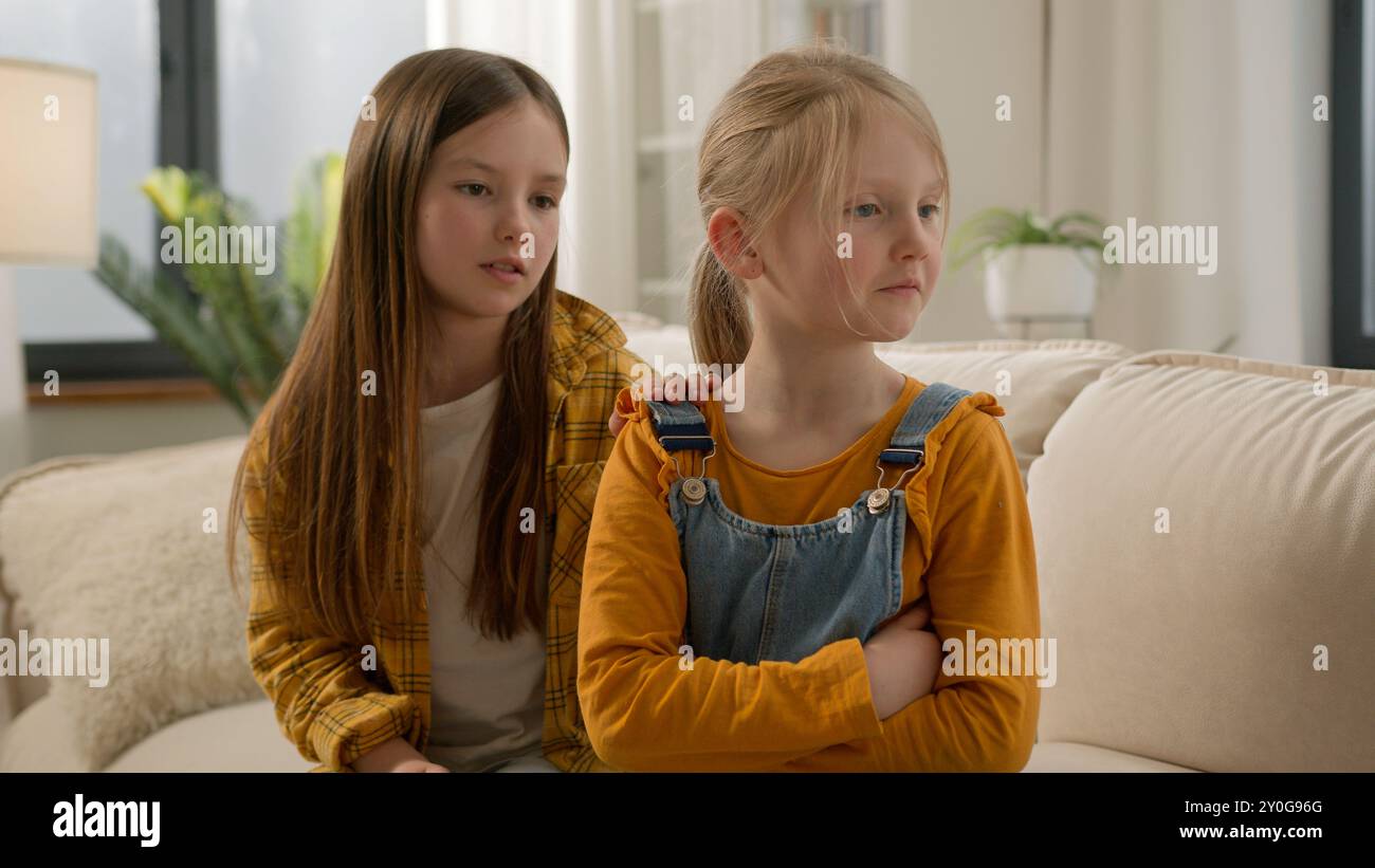 Upset angry little Caucasian children girls sisters kids friends ...