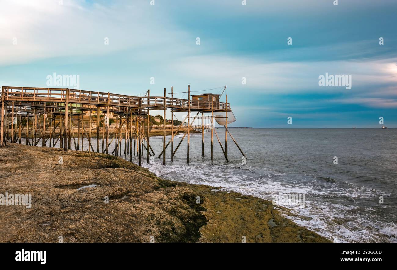 Traditional fisherman hut on stilts with carrelet fishing net. Wooden ...