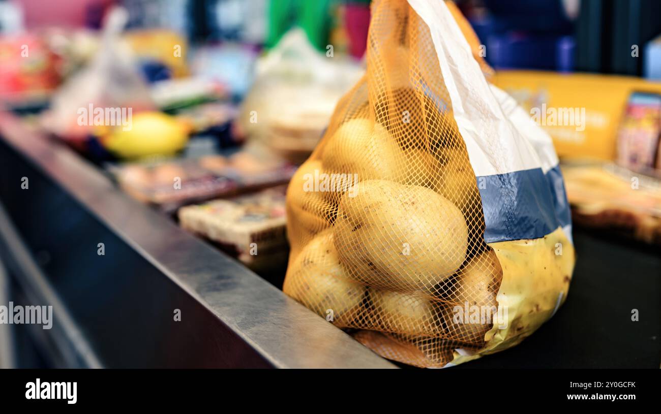 Potato pack net on supermarket shelf. Fresh vegetables divercity in ...