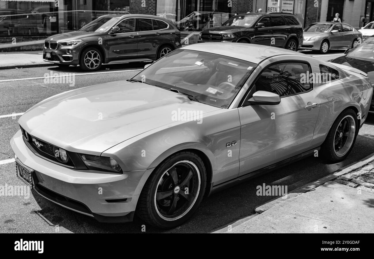 New York City, USA - August 05, 2023: 2011 Ford Mustang V6 yellow car ...