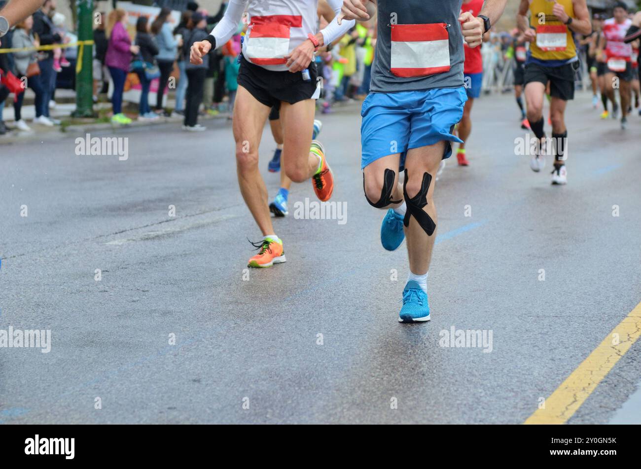Marathon running race, many runners feet on road racing, sport ...
