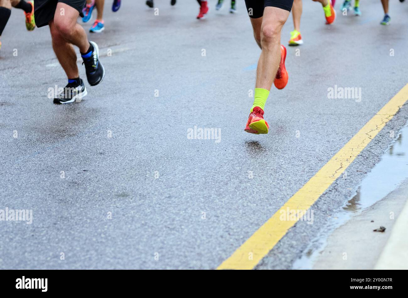 Marathon running race, many runners feet on road racing, sport ...