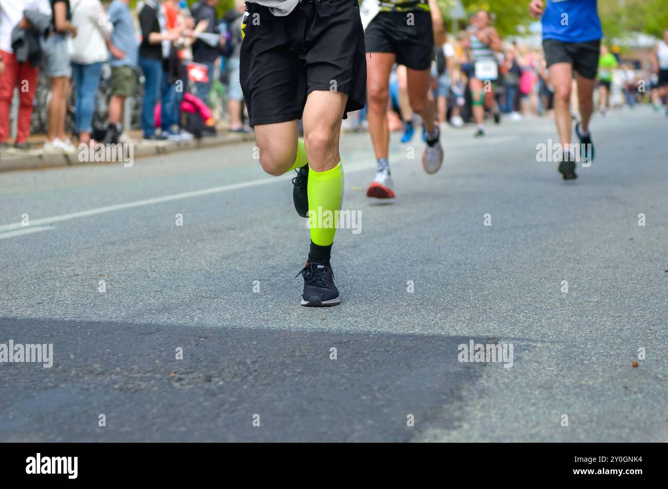 Marathon running race, many runners feet on road racing, sport ...